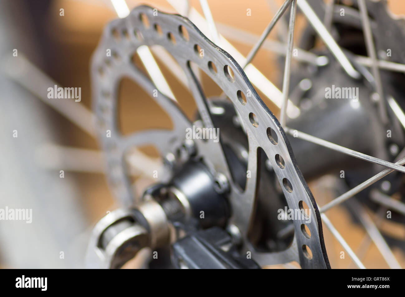 Closeup cogwheel attached to bicycle wheel, mechanical repair concept ...
