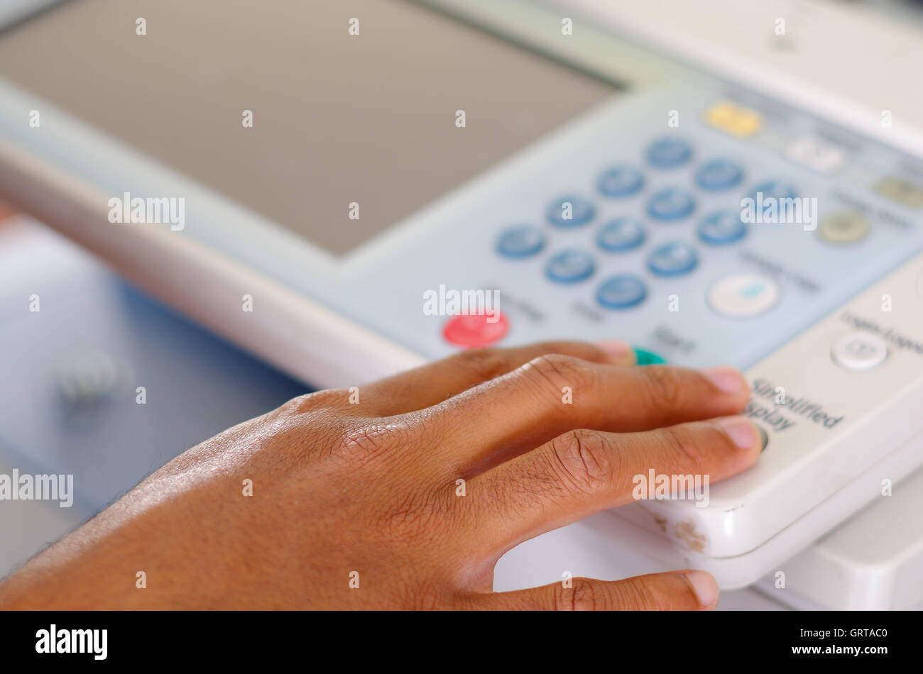 Man pressing buttons on machine hi-res stock photography and images - Alamy