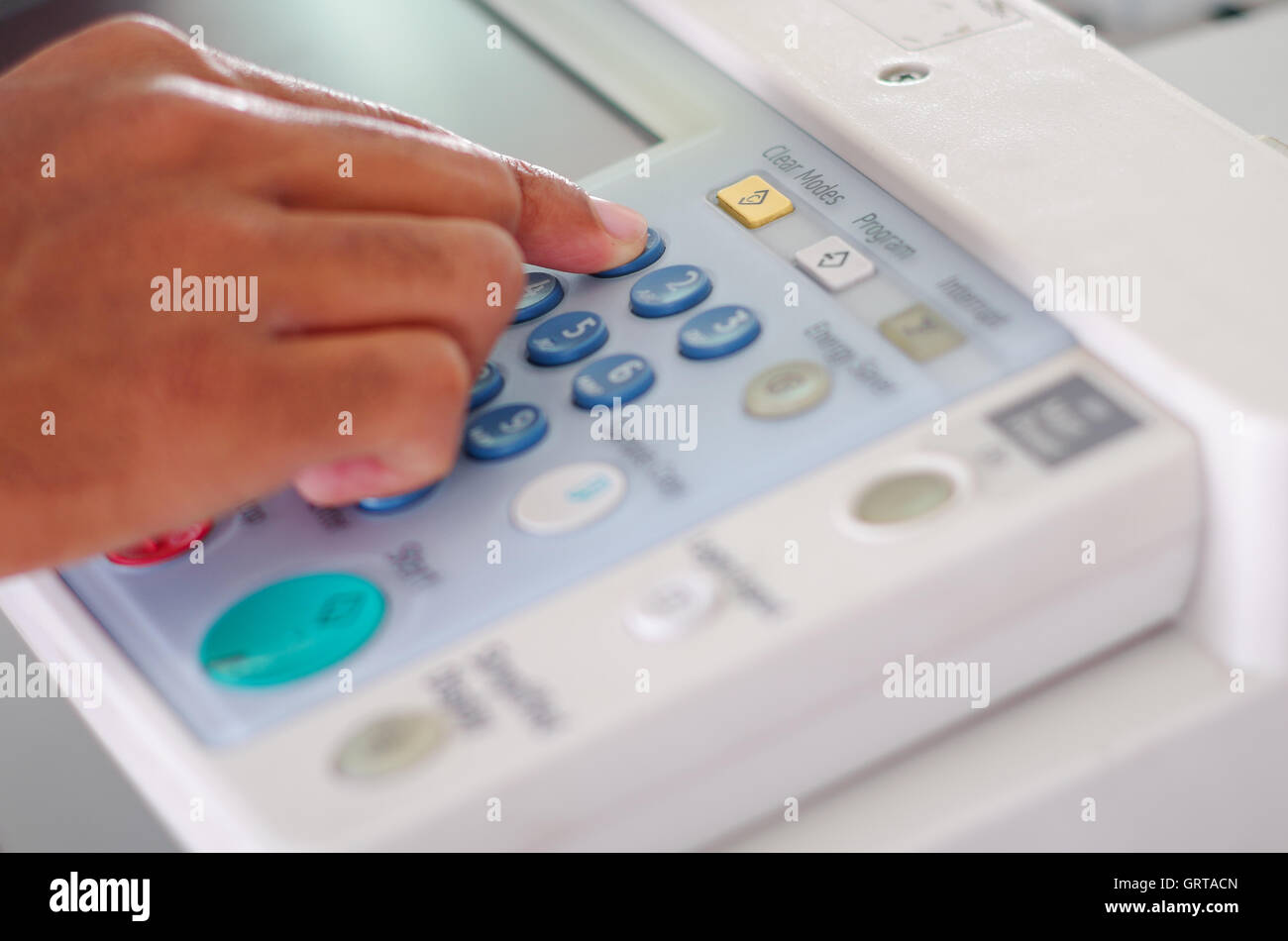 Man pressing buttons on machine hi-res stock photography and images - Alamy