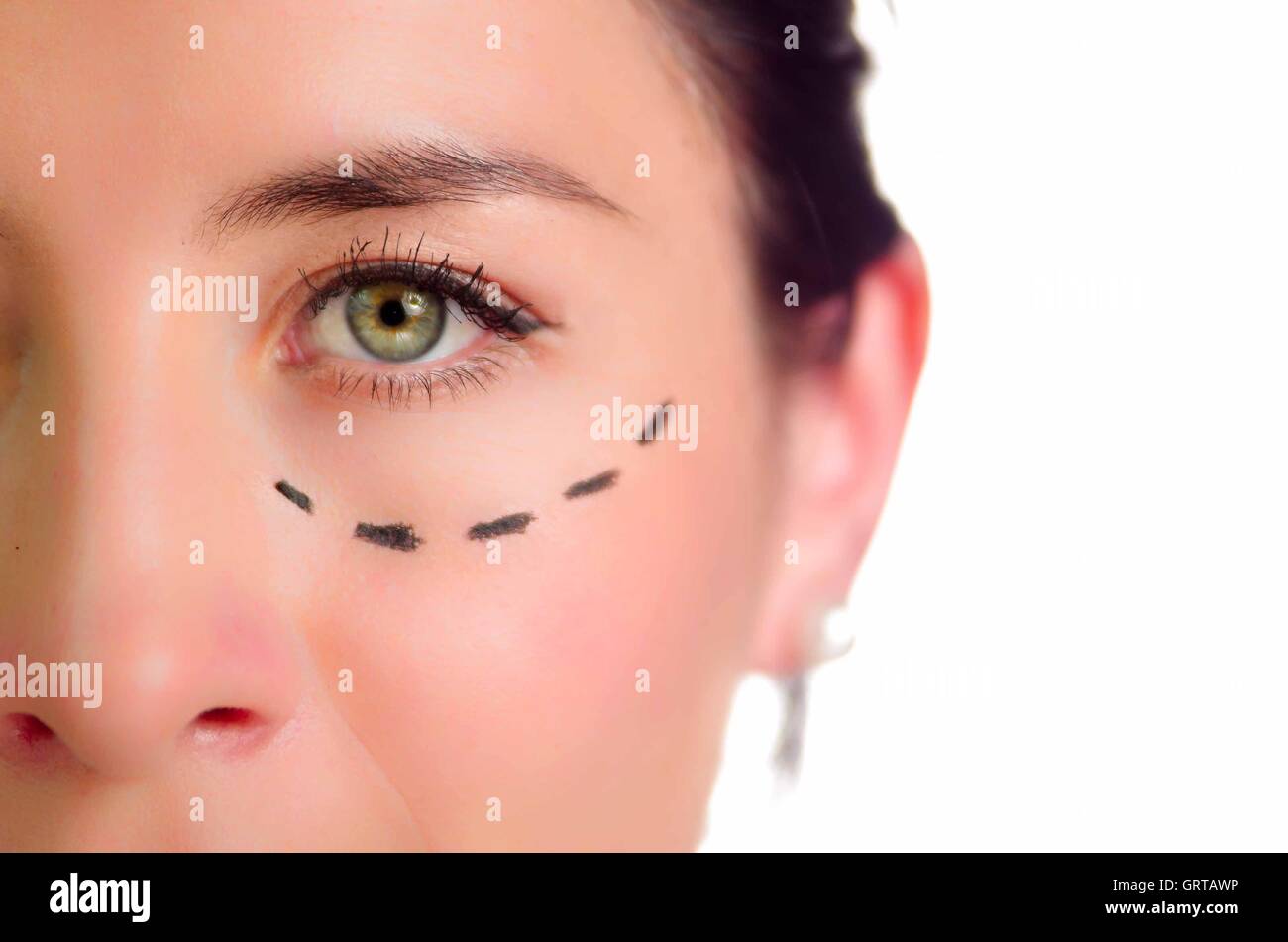 Closeup half of face caucasian woman with dotted lines drawn around ...