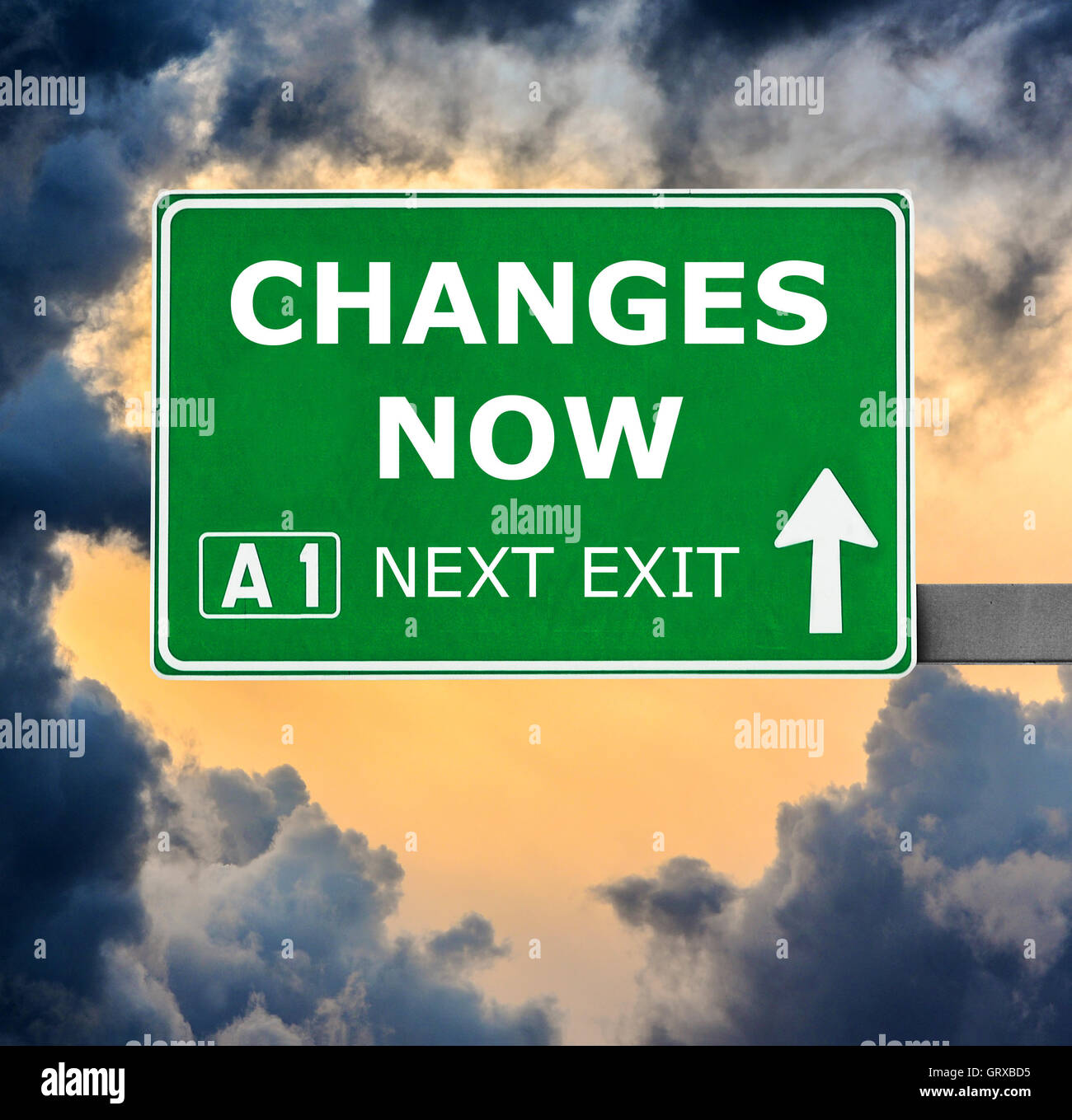 CHANGES NOW road sign against clear blue sky Stock Photo - Alamy