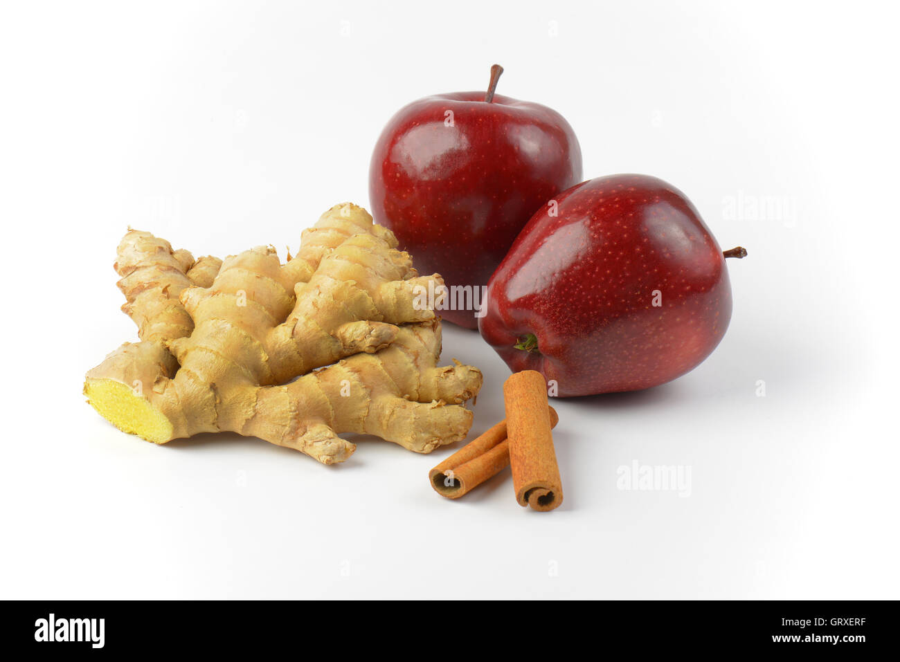 two fresh red apples, ginger root and cinnamon sticks Stock Photo - Alamy