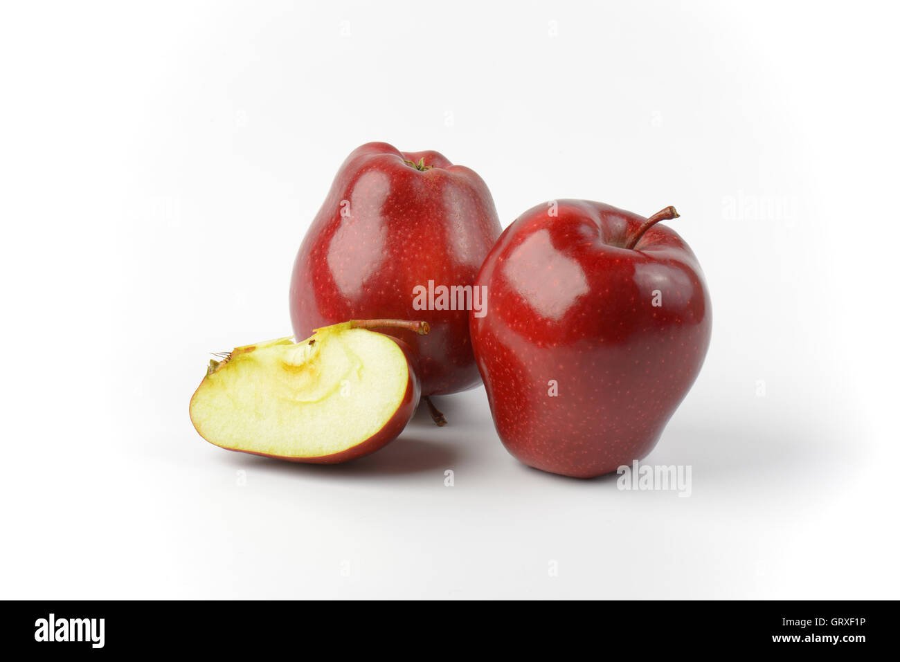 two red apples on off-white background Stock Photo - Alamy