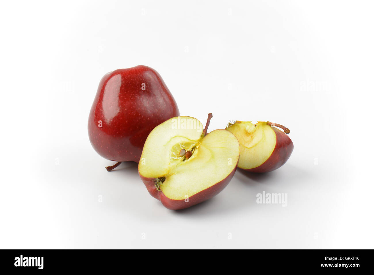 one whole red apple, one half and slice Stock Photo - Alamy