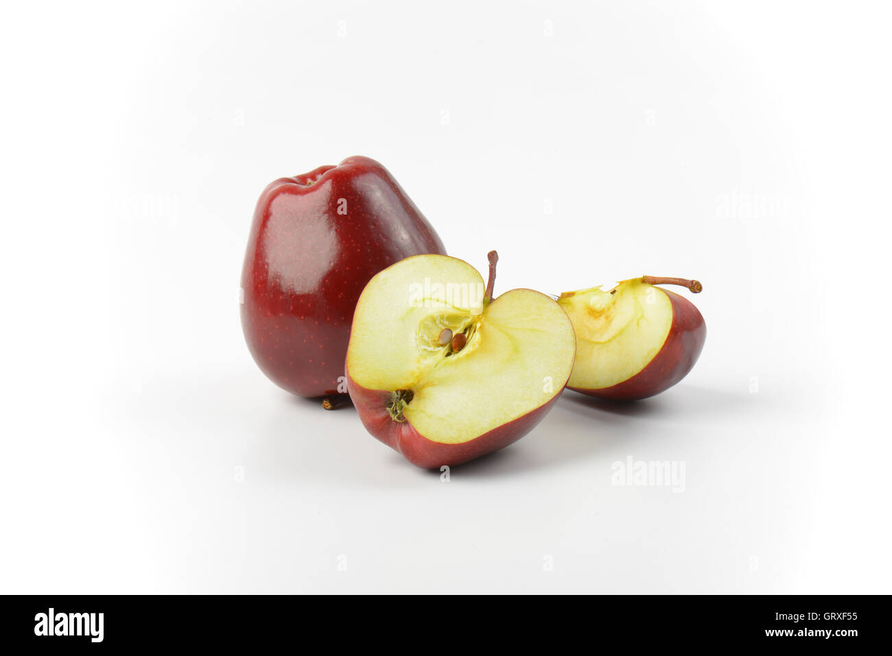one whole red apple, one half and slice Stock Photo - Alamy