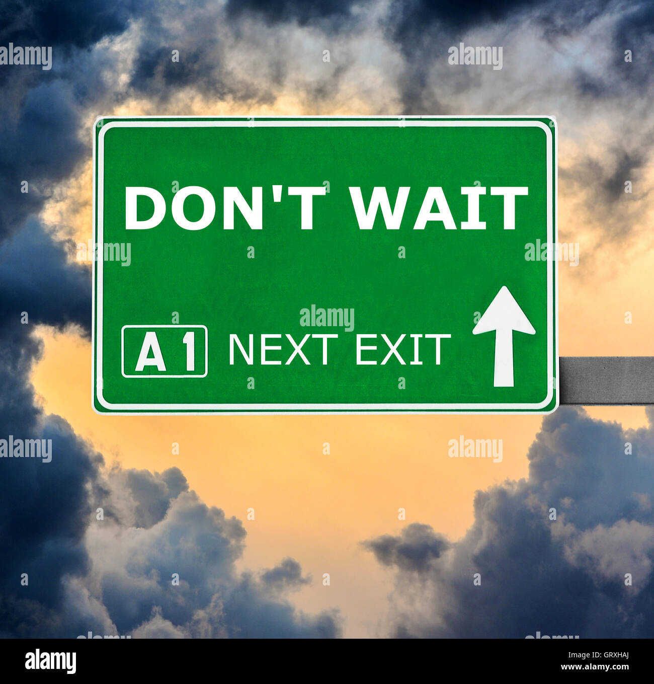 DON'T WAIT road sign against clear blue sky Stock Photo - Alamy
