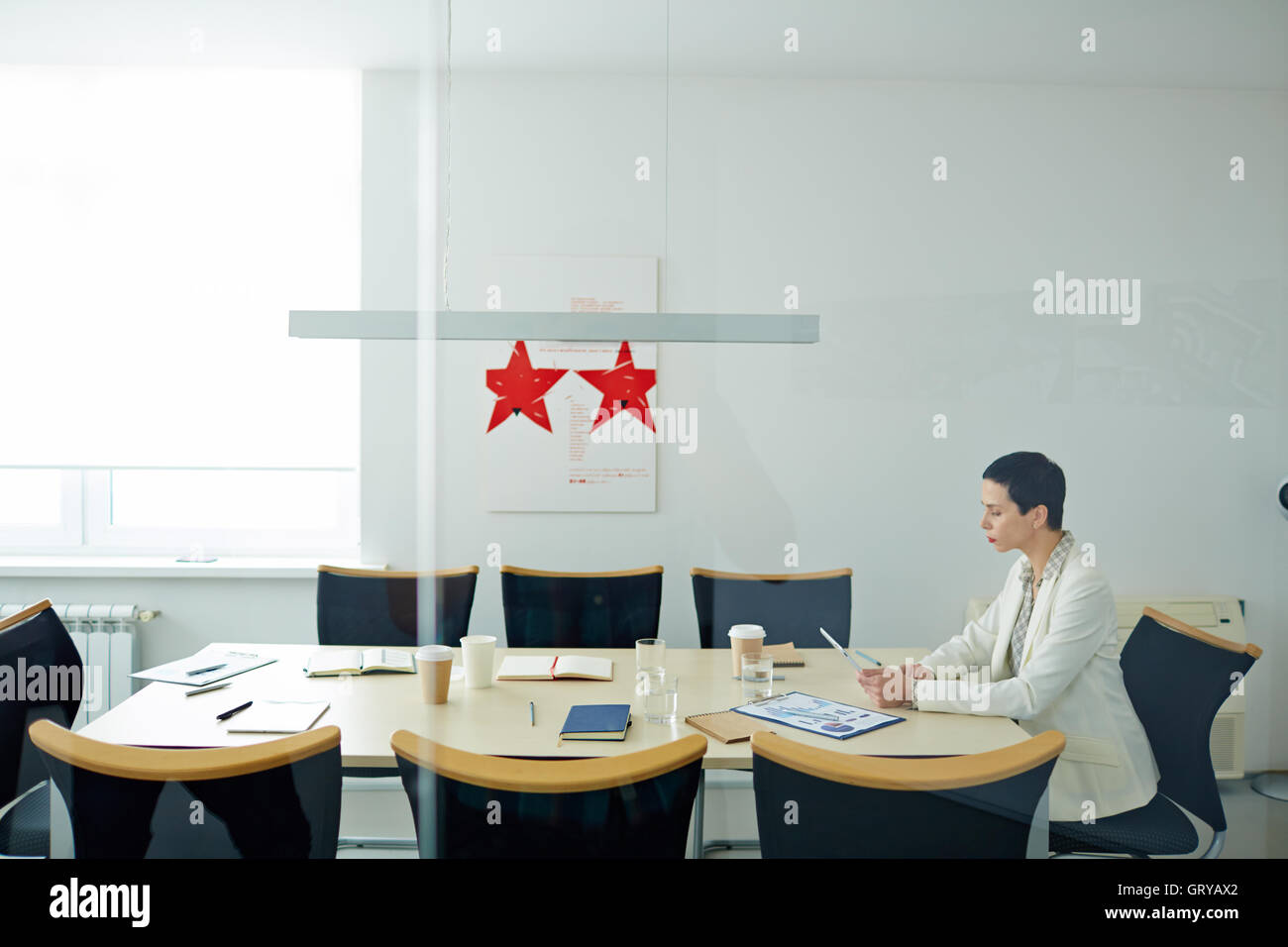 Employer working in office Stock Photo - Alamy