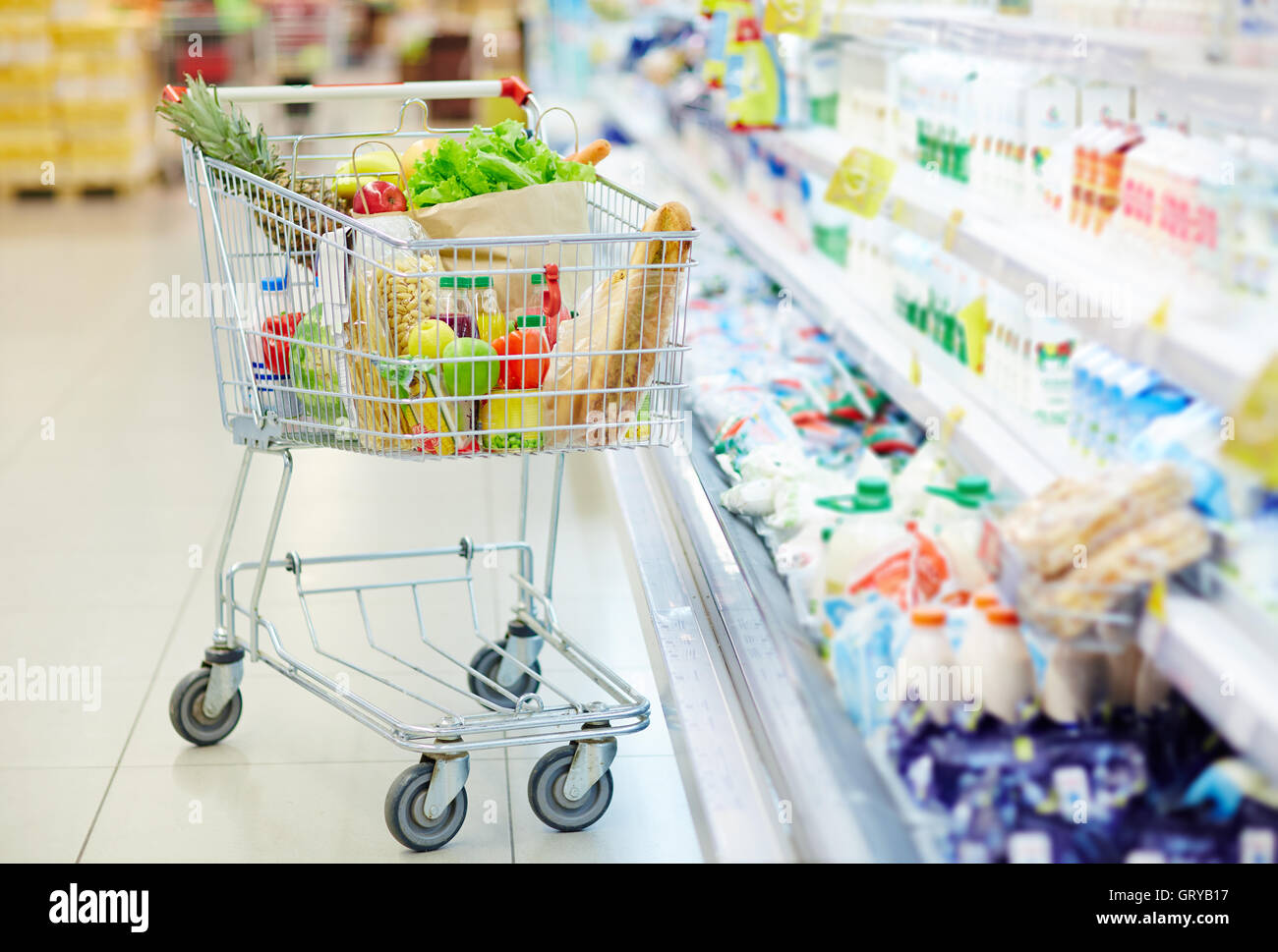 Products in consumer cart Stock Photo - Alamy