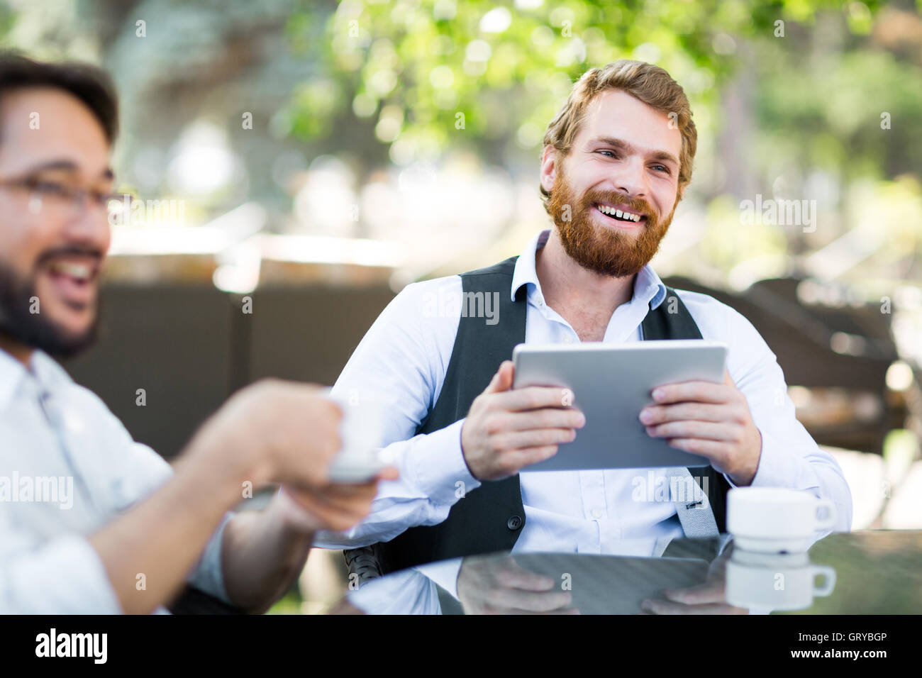 Discussion of co-workers Stock Photo - Alamy