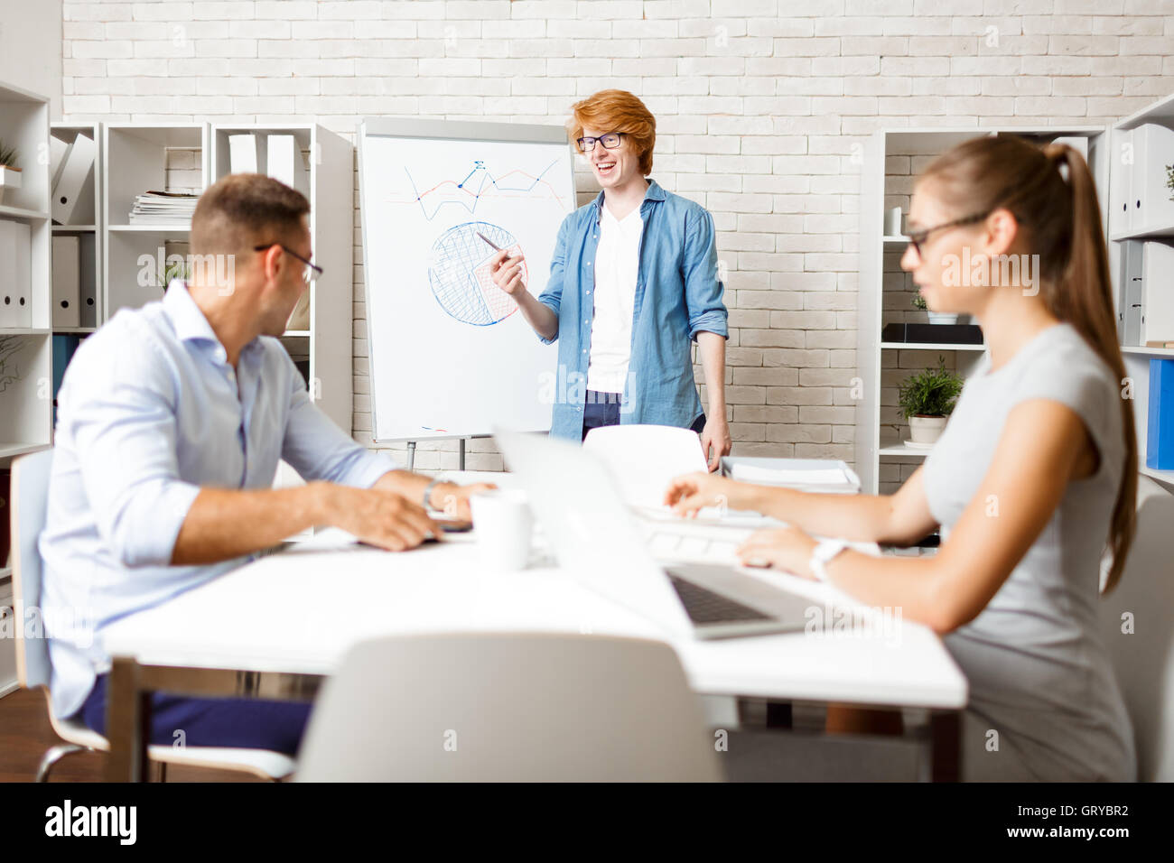 Businesswoman explaining pie chart hi-res stock photography and images ...