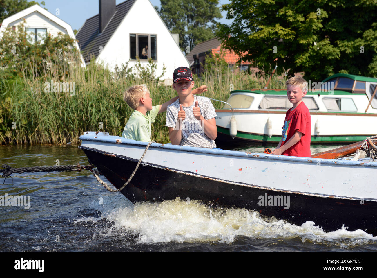 Dutch boys having fun on their boat in one of Haarlem's canals Stock ...