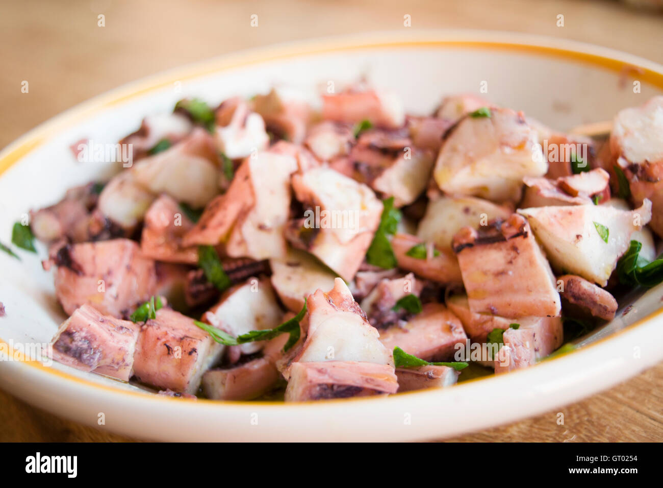 summer and cold octopus salad with oil and lemon Stock Photo - Alamy