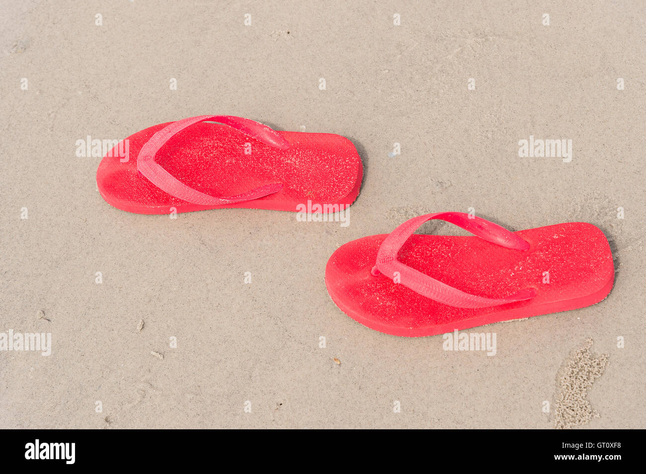 red sandals on beach Stock Photo - Alamy