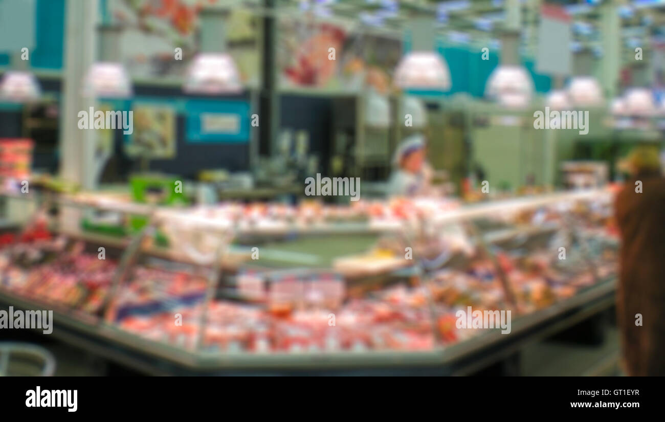 Supermarket blur background with bokeh, meat and sausages product shelf ...