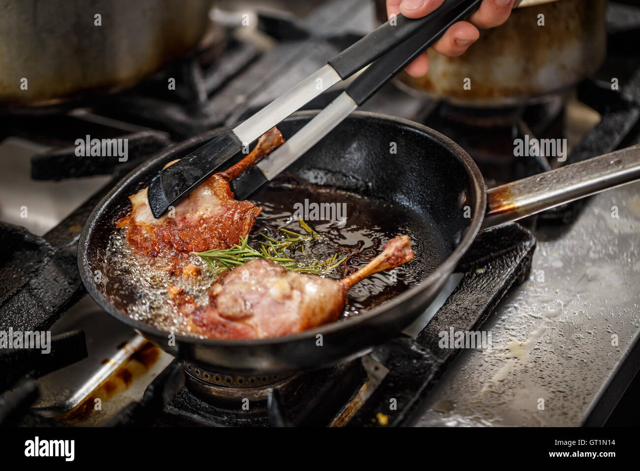 Duck leg roasted in a pan Stock Photo - Alamy