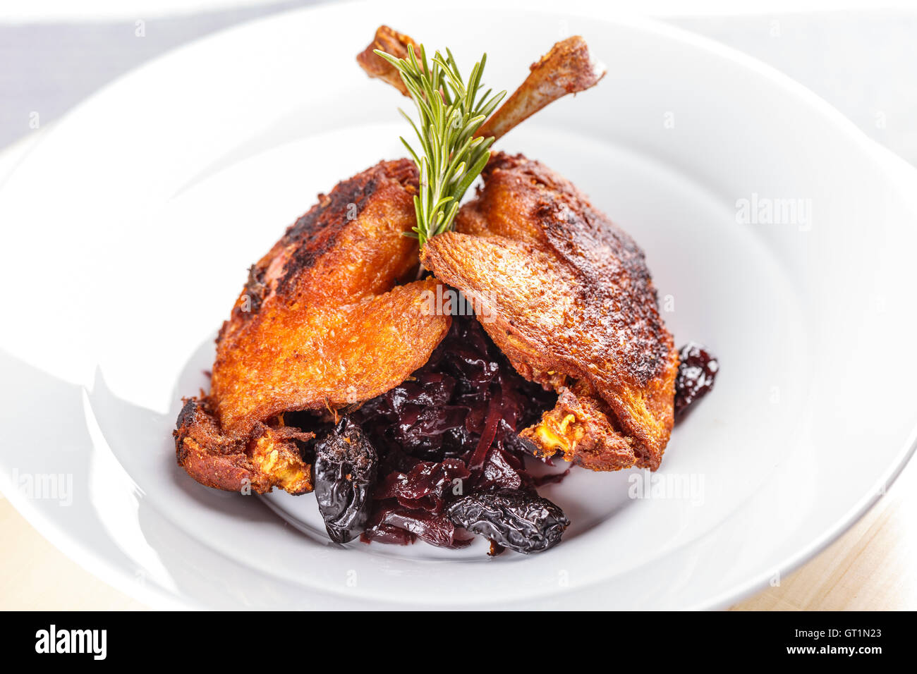 Roasted duck leg with braised red cabbage Stock Photo - Alamy