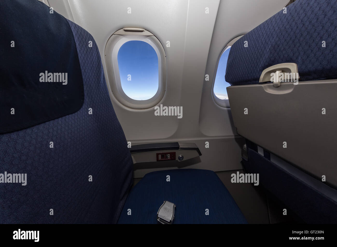 Airplane seat and window inside an aircraft. Image with shallow depth ...