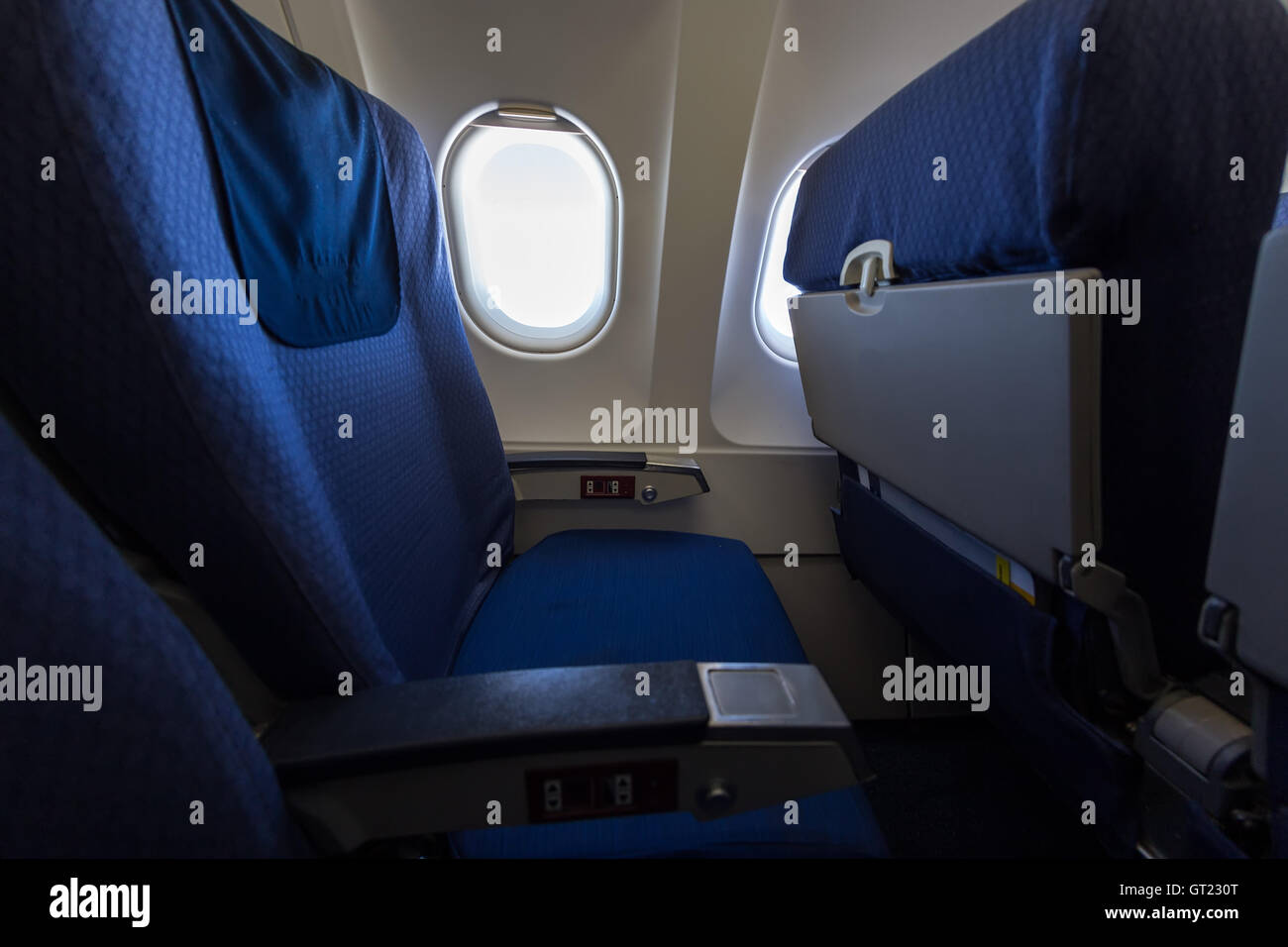 Airplane seat and window inside an aircraft. Image with shallow depth ...