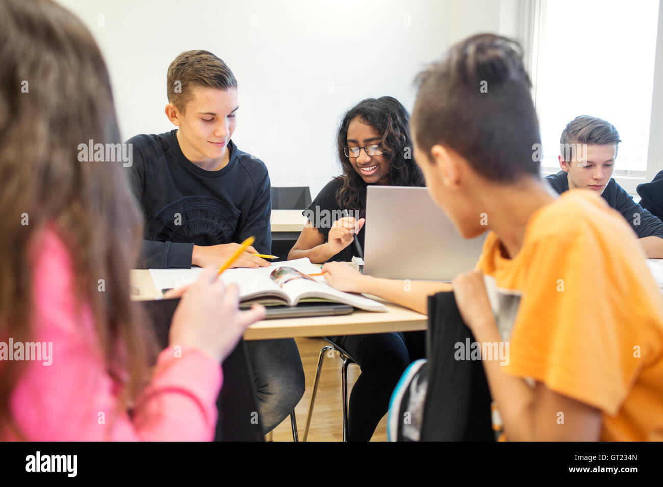 Schoolchildren (12-13, 14-15) in classroom Stock Photo - Alamy