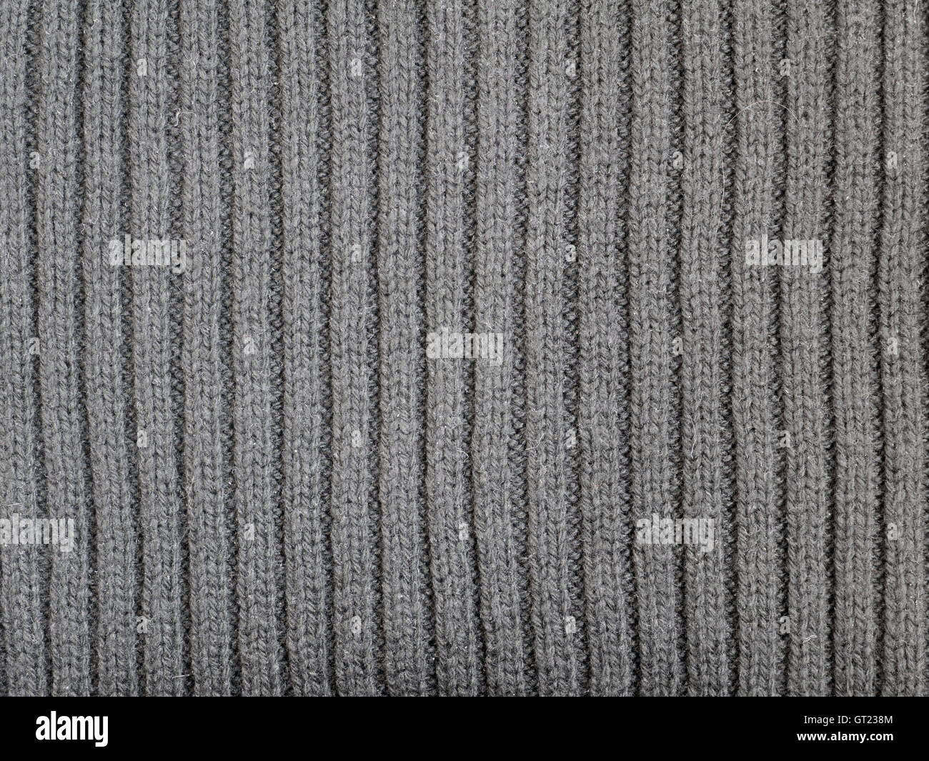 Gray ribbed knitted wool fabric cold weather background Stock Photo - Alamy