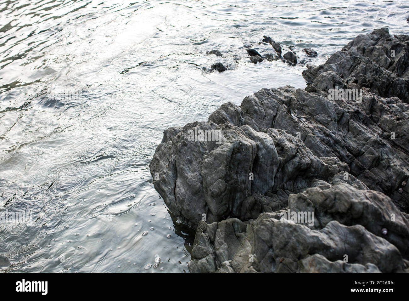 Grey stone on the Uk coastline Stock Photo - Alamy