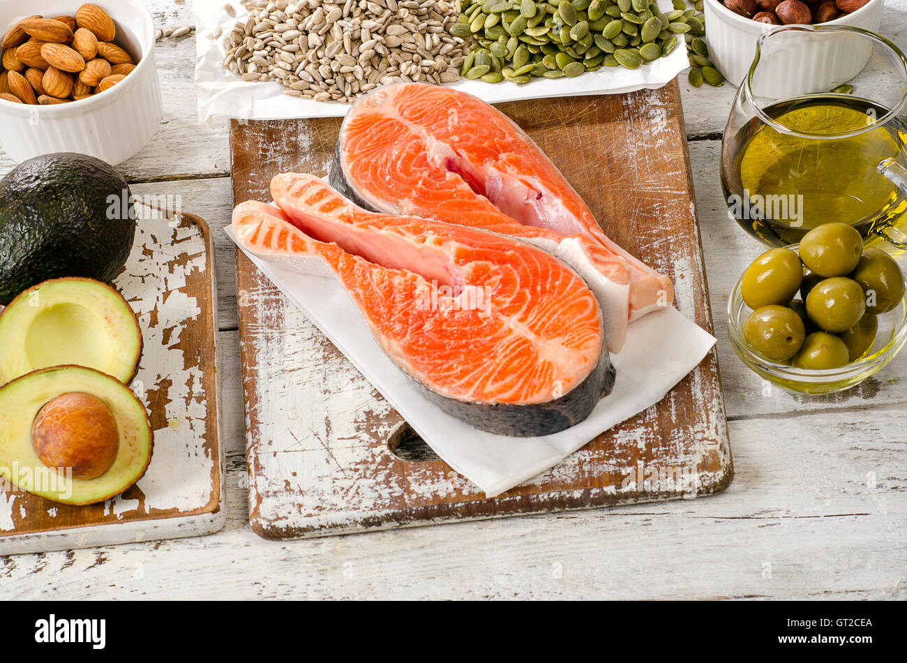 Healthy Food: Best Sources of healthy fats on a white wooden background ...