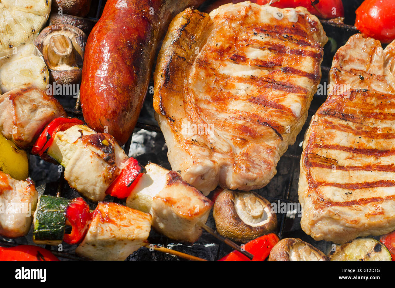 Grilled pork chops with vegetables. Top view Stock Photo - Alamy