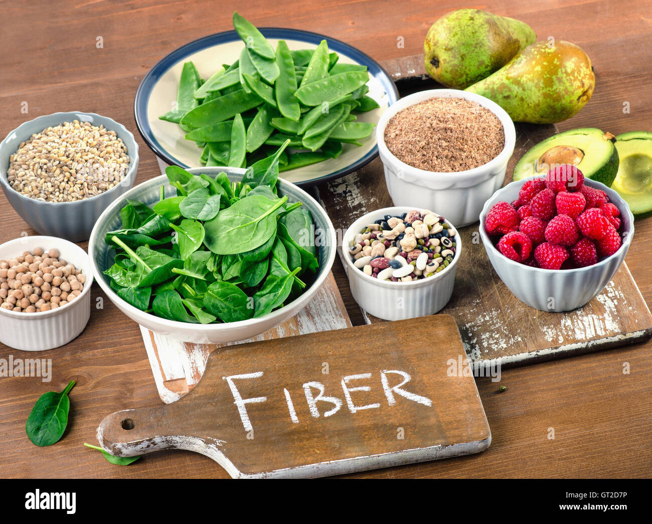Fiber rich foods on wooden board. Healthy eating. Top view Stock Photo ...