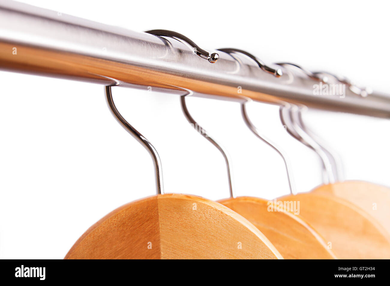 Empty raw of hangers isolated on white Stock Photo - Alamy