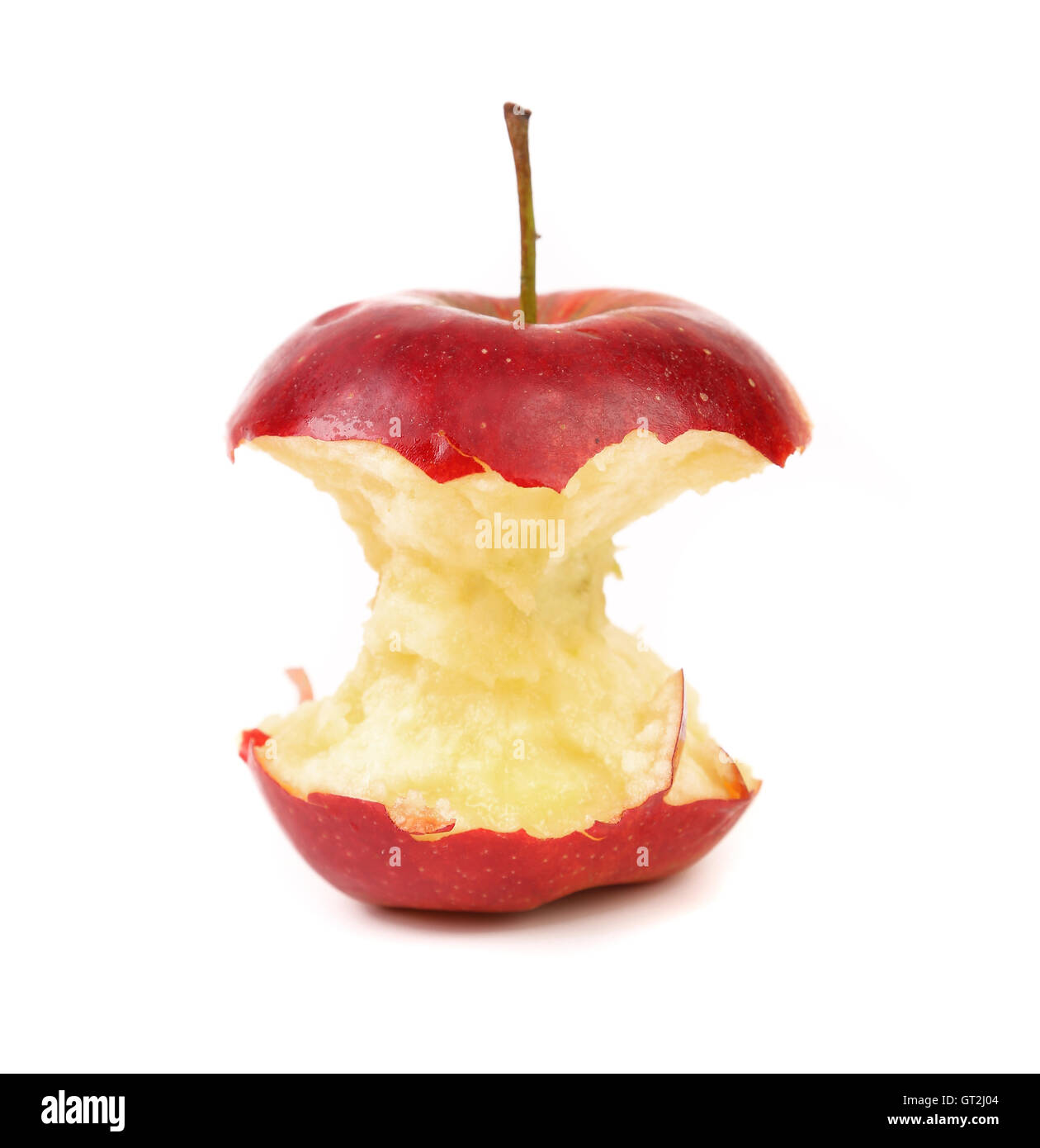 Red apple core on a white background Stock Photo - Alamy