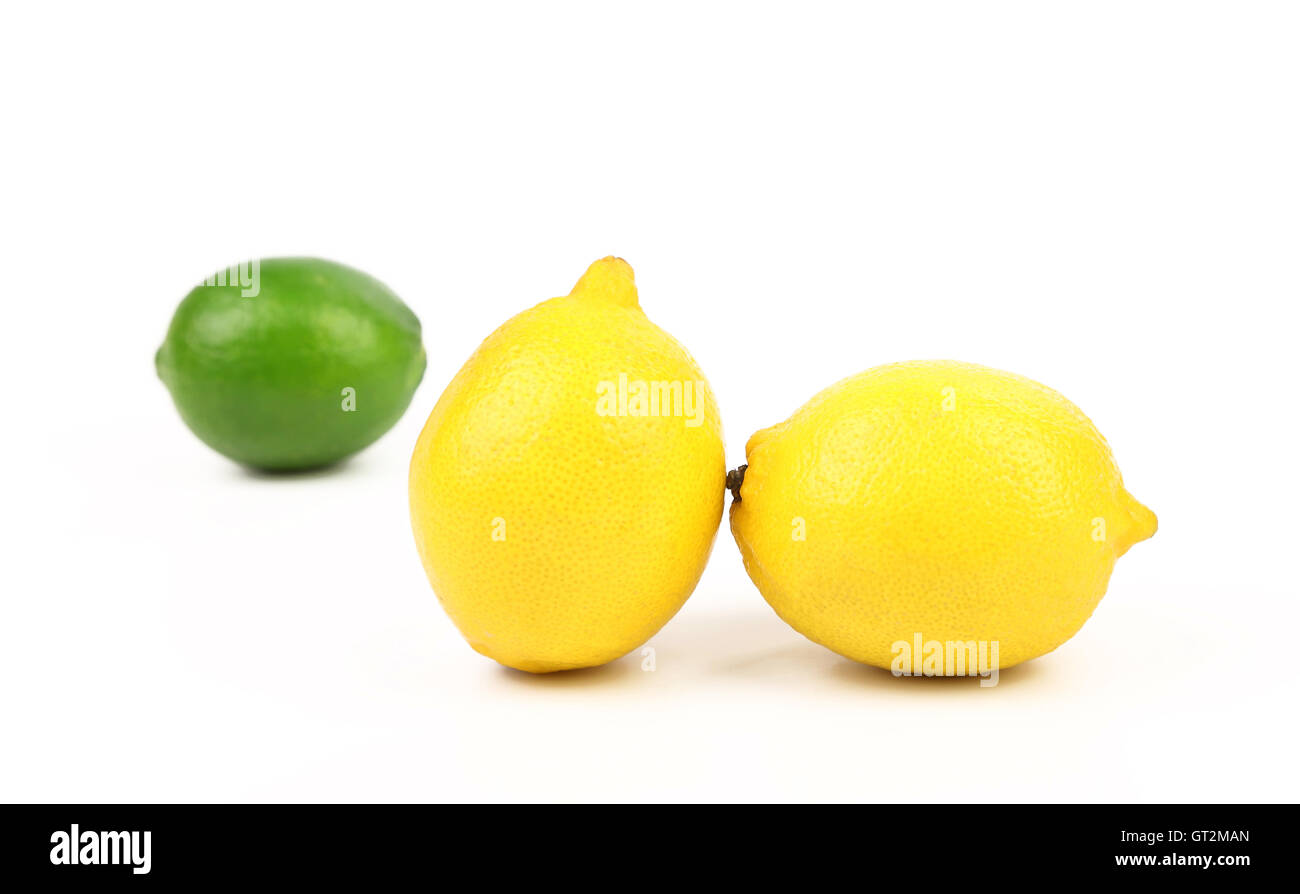 Fresh lime, two lemons isolated on white Stock Photo - Alamy