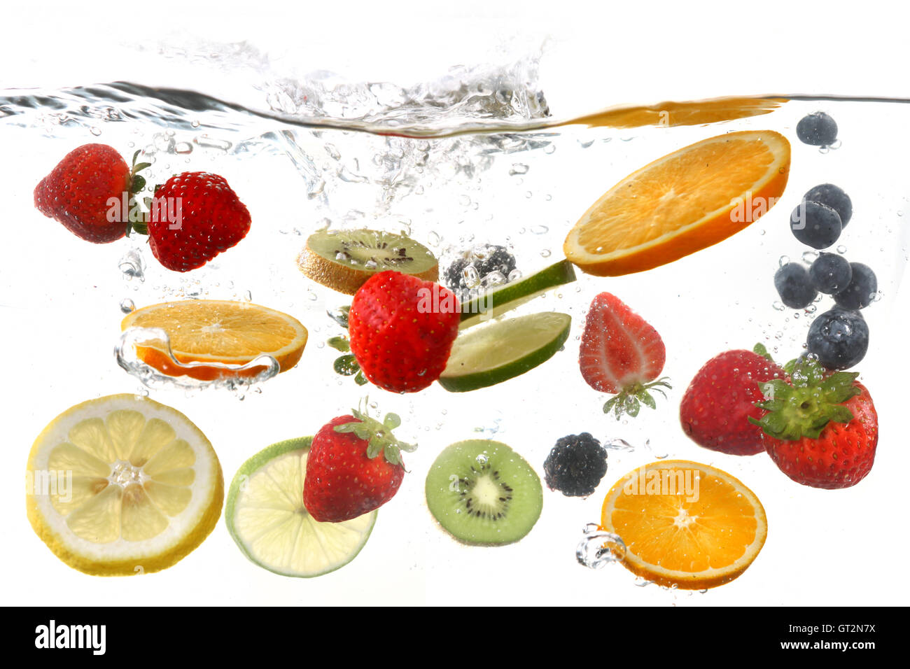 Fruits Falling Into Splashing Clear Water Stock Photo - Alamy