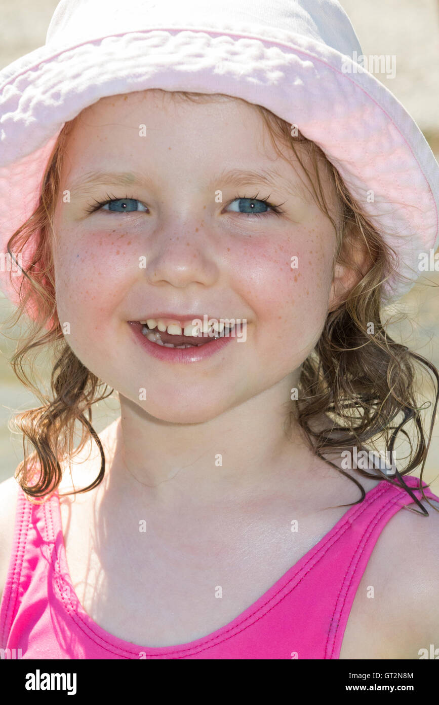 Four 4 year old girl / child / kid wearing sun hat, swim suit bathing ...