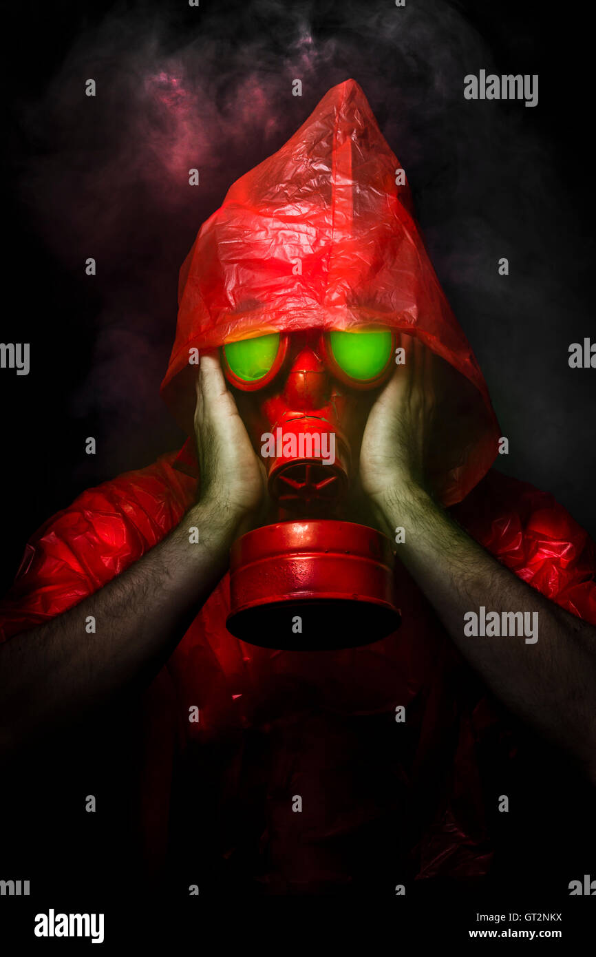 Toxic military concept, man with red gas mask Stock Photo - Alamy