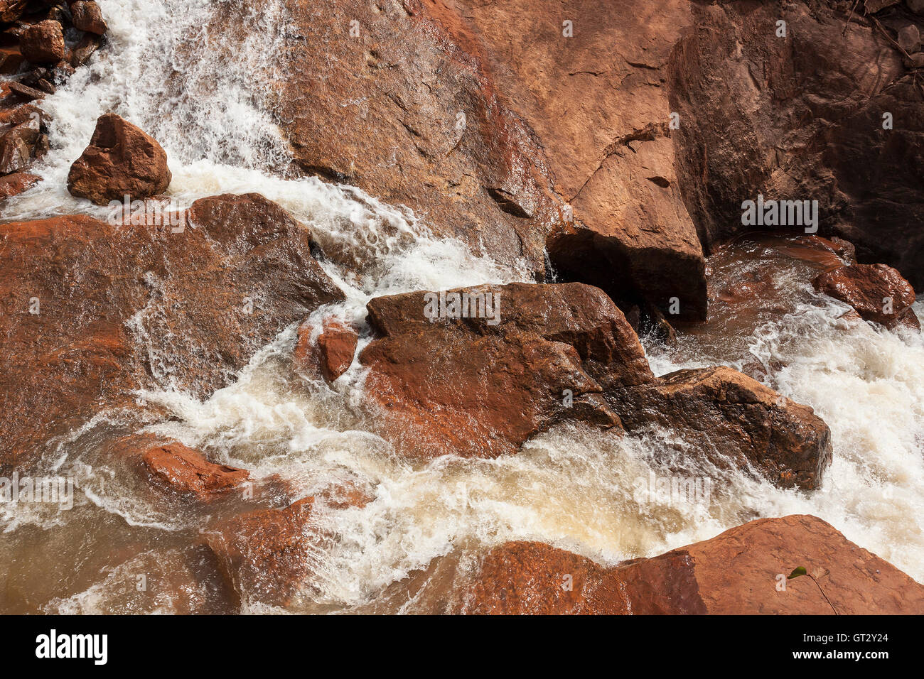 Mining operations for producing and managing iron ore. Newly built dam ...