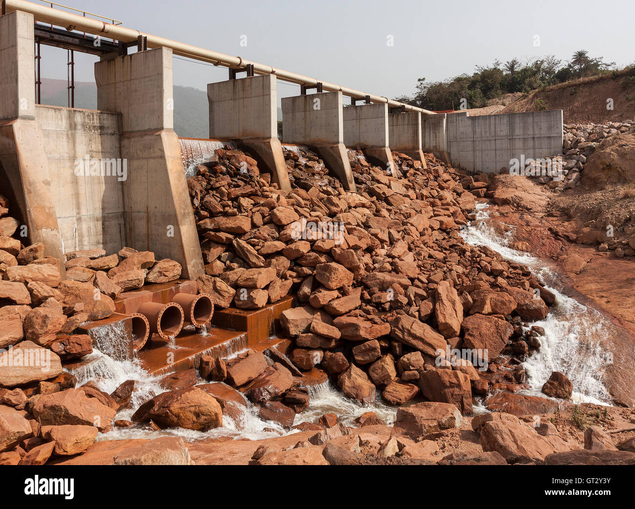 Mining operations for producing and managing iron ore. Newly built dam ...