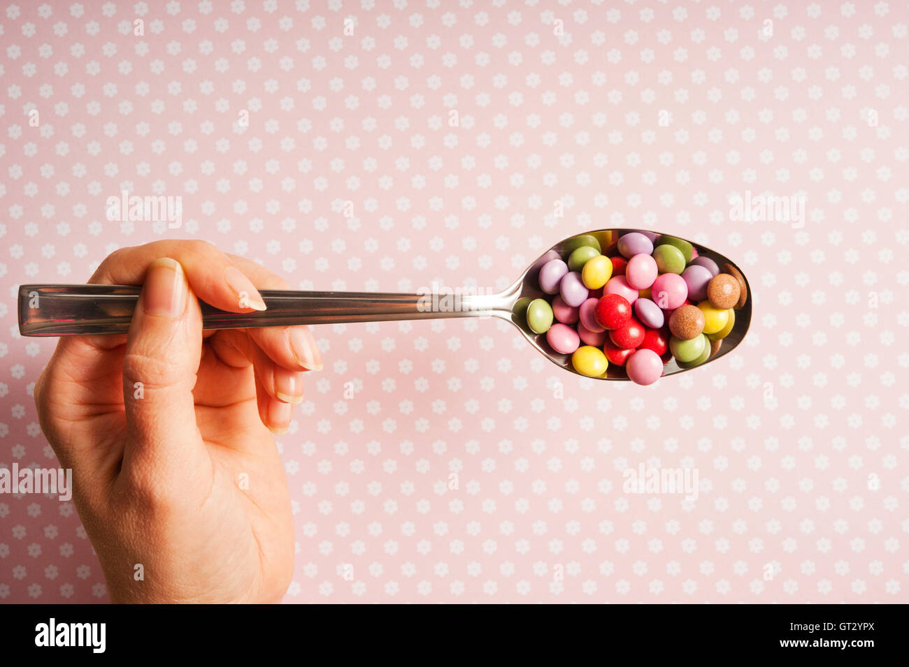 Candies hand hi-res stock photography and images - Alamy