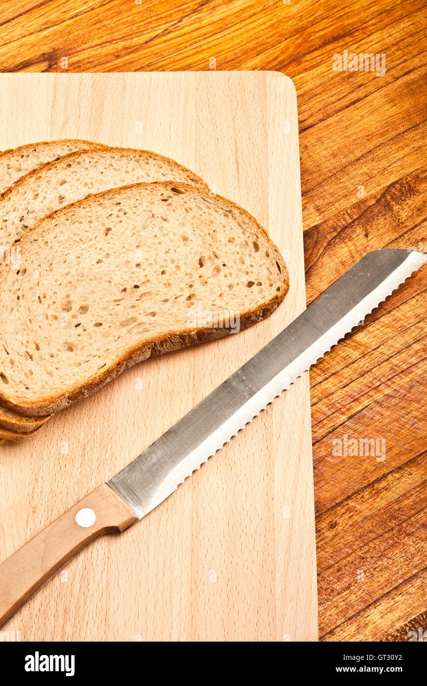 bread sliced on a cutter Stock Photo - Alamy