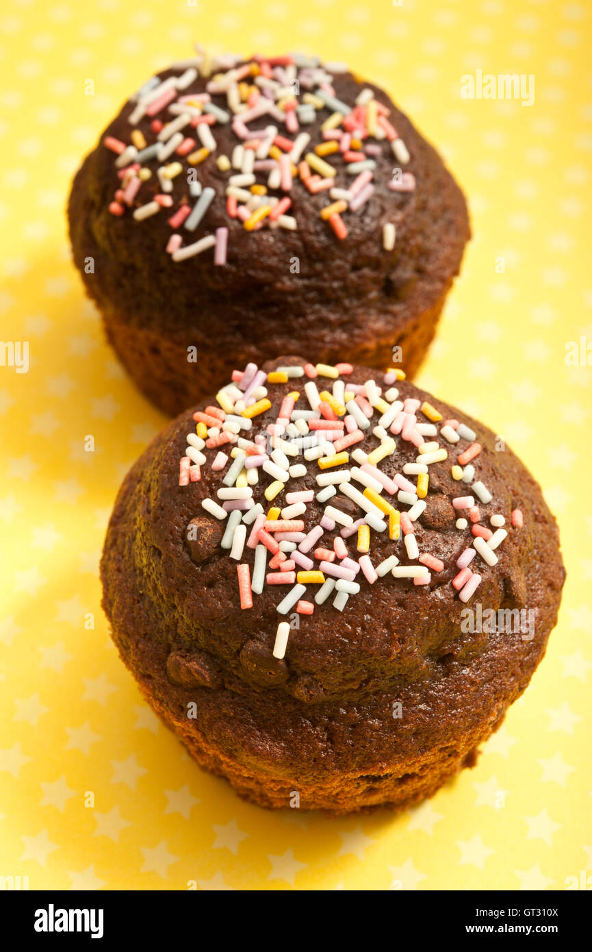 chocolate muffin decorated with colorful sprinkles Stock Photo - Alamy
