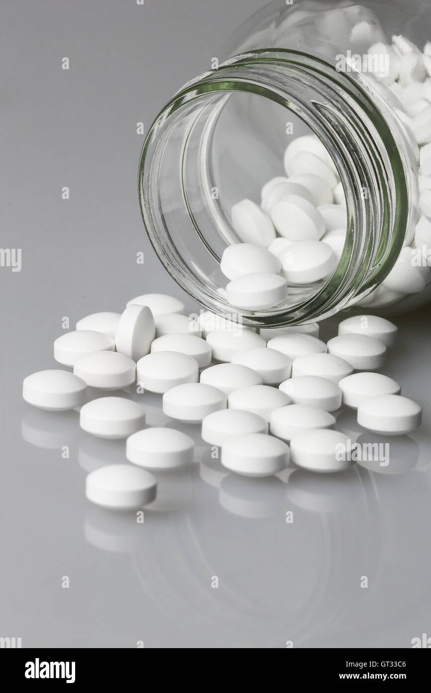 A bottle and tablets Stock Photo - Alamy