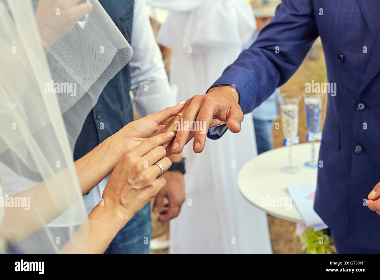 Husband wife putting wedding rings hi-res stock photography and images ...