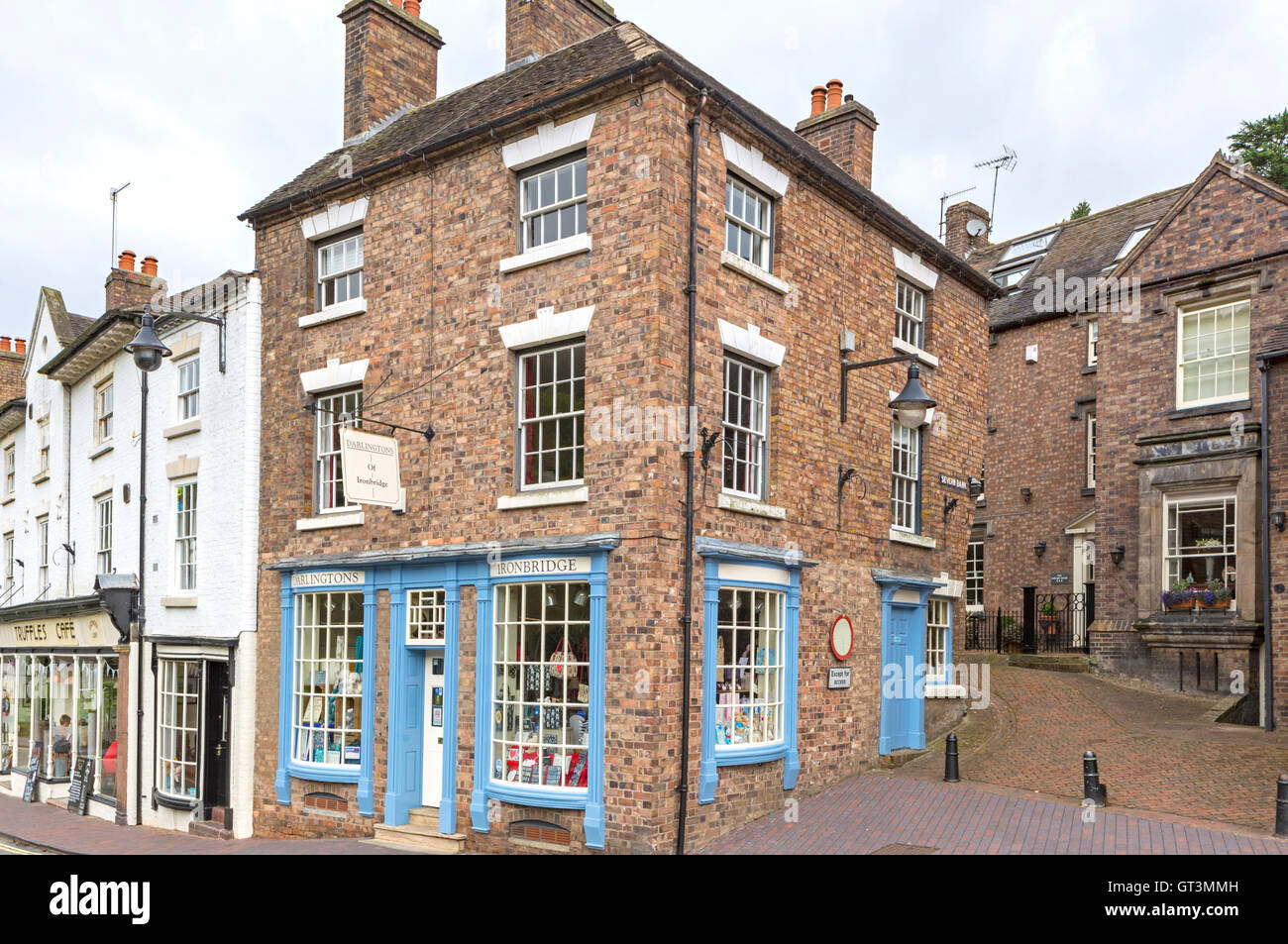 Historic buildings alongside the Wharfage in the Shropshire village of ...