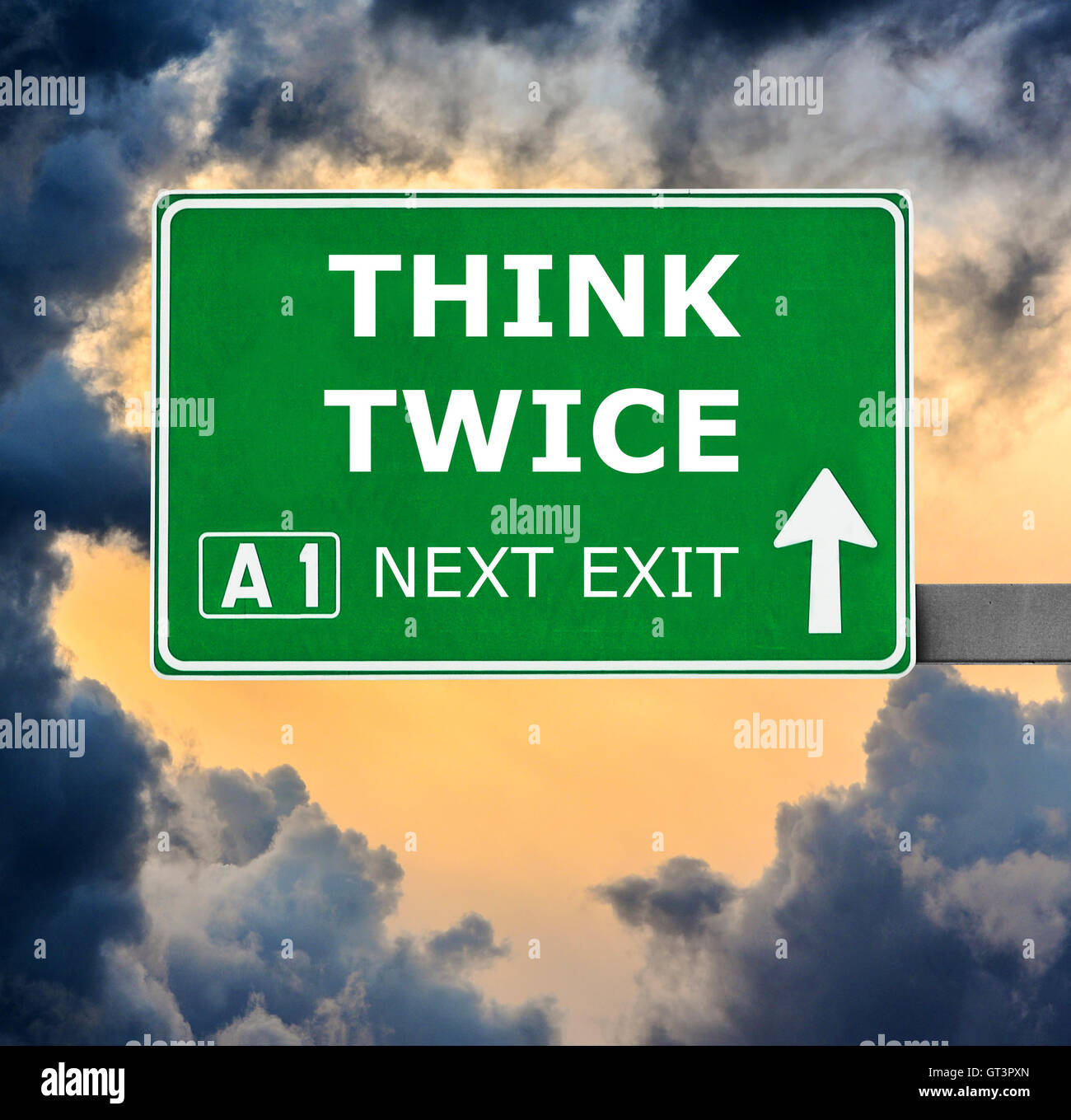 THINK TWICE road sign against clear blue sky Stock Photo - Alamy