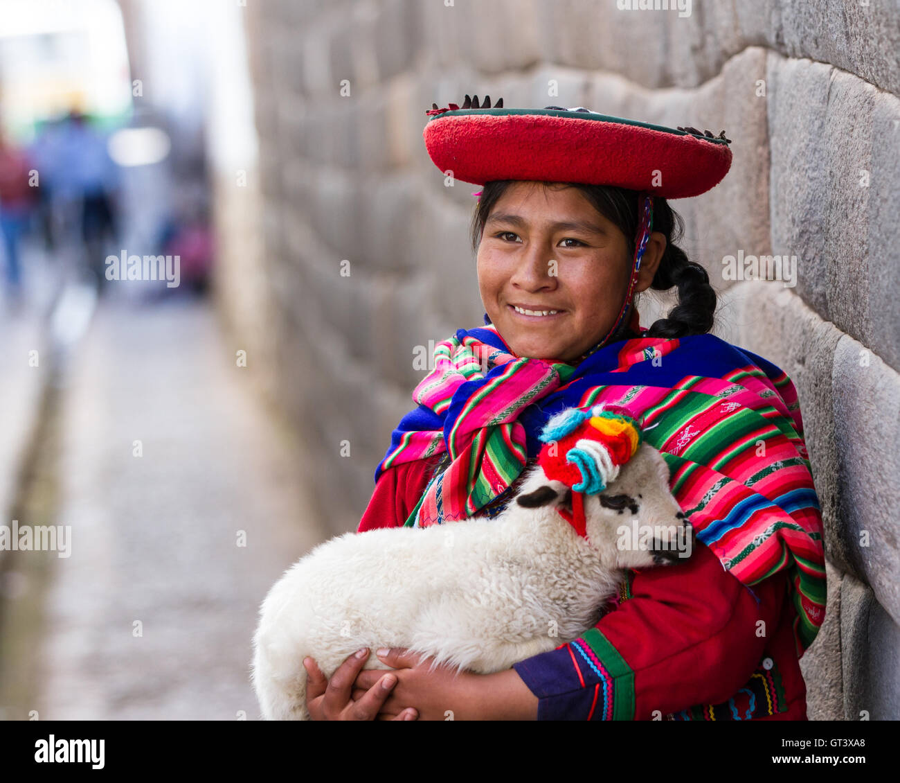 Cusco, Peru - May 14 : Jenni, a young woman dressed in colorful ...