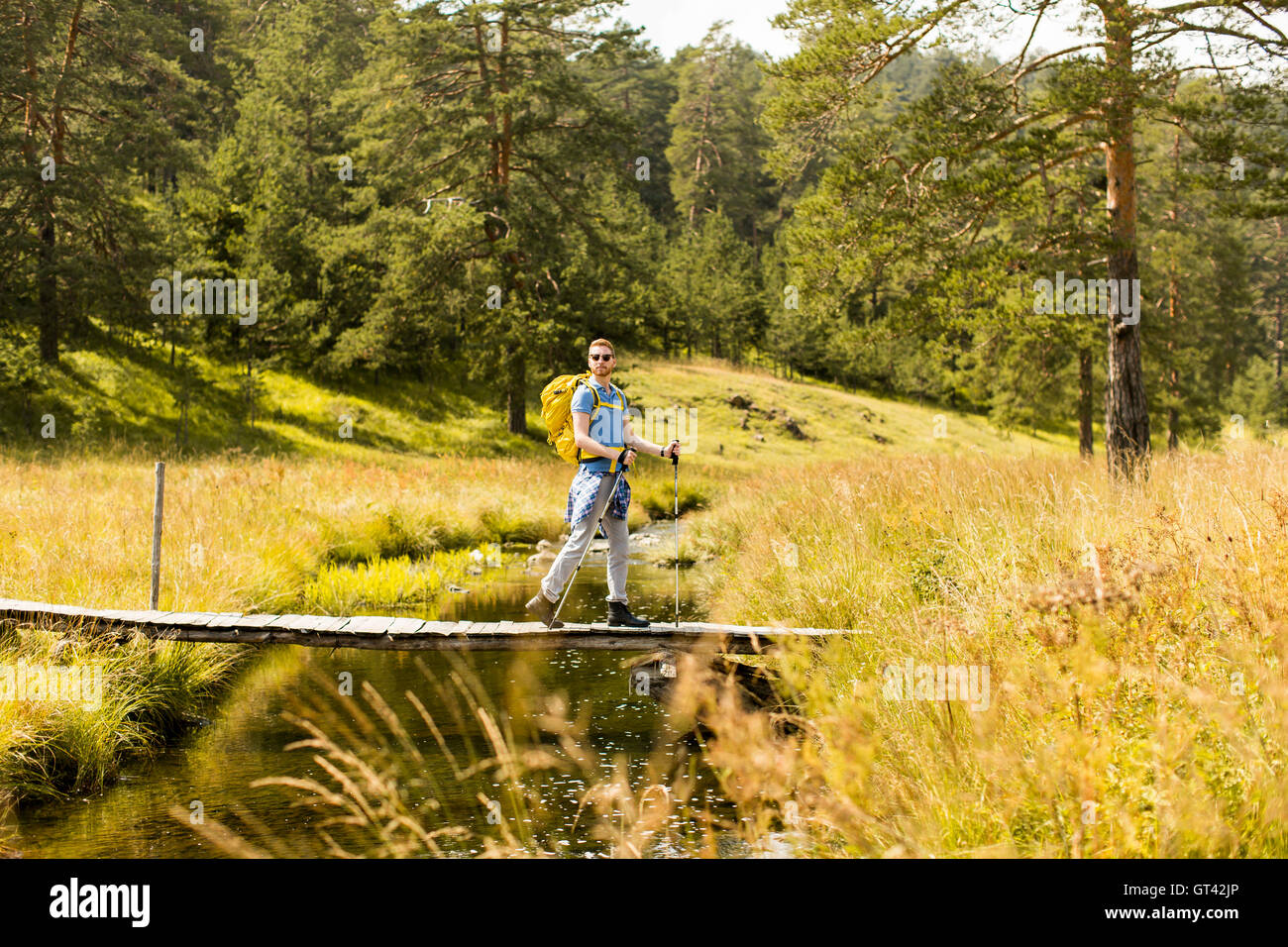 Young man crosses mountain hi-res stock photography and images - Alamy