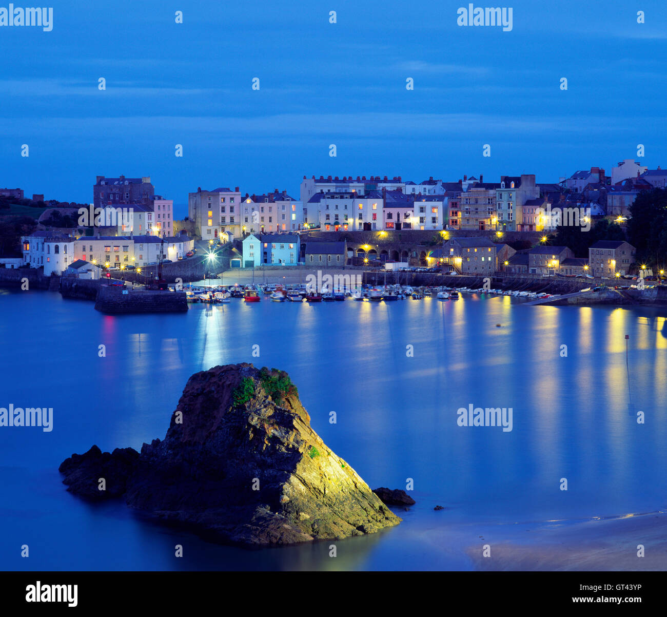 Tenby harbour and town at dusk, Pembrokeshire, Wales, UK Stock Photo ...