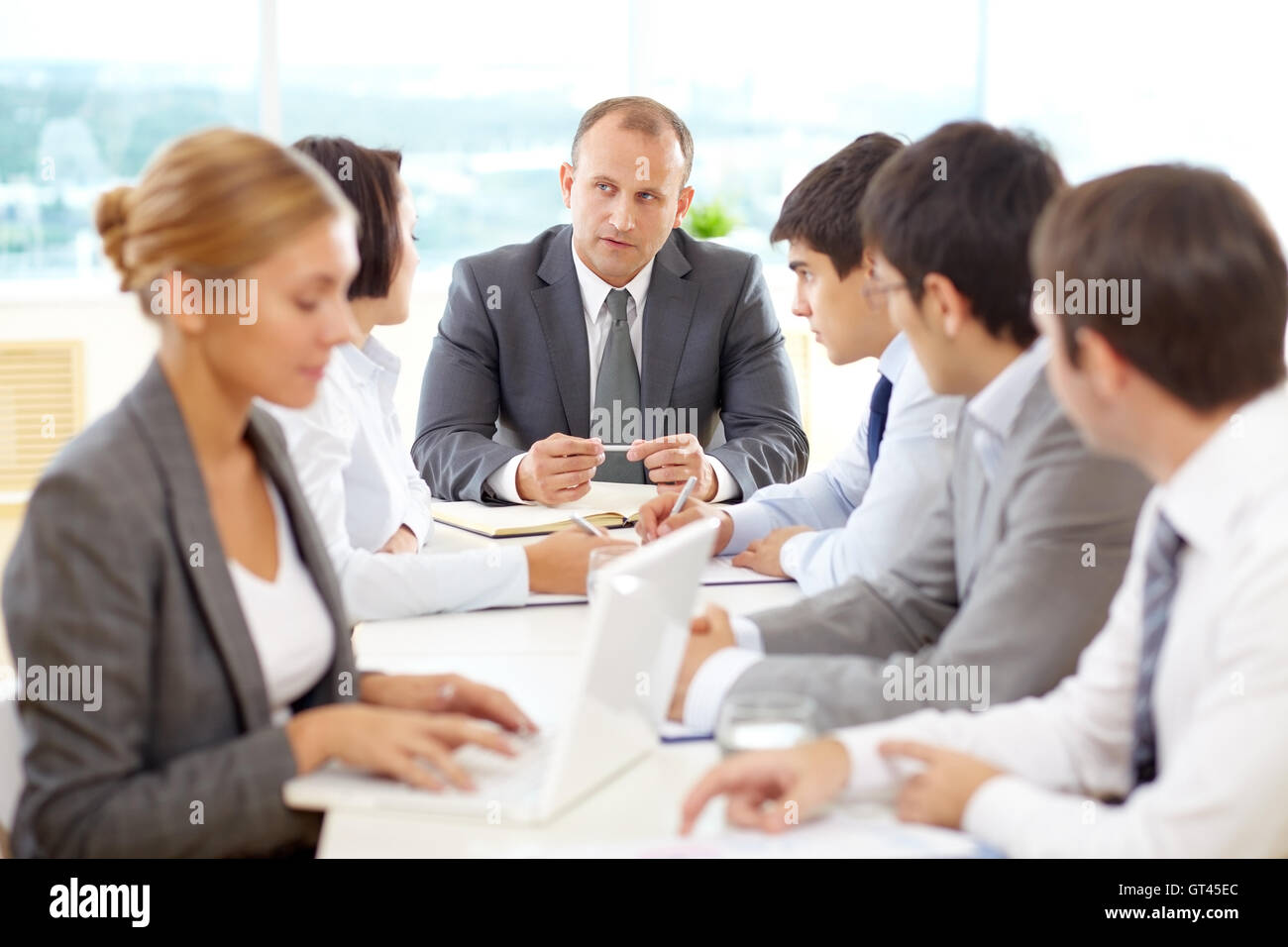 Business meeting at conference table Stock Photo - Alamy