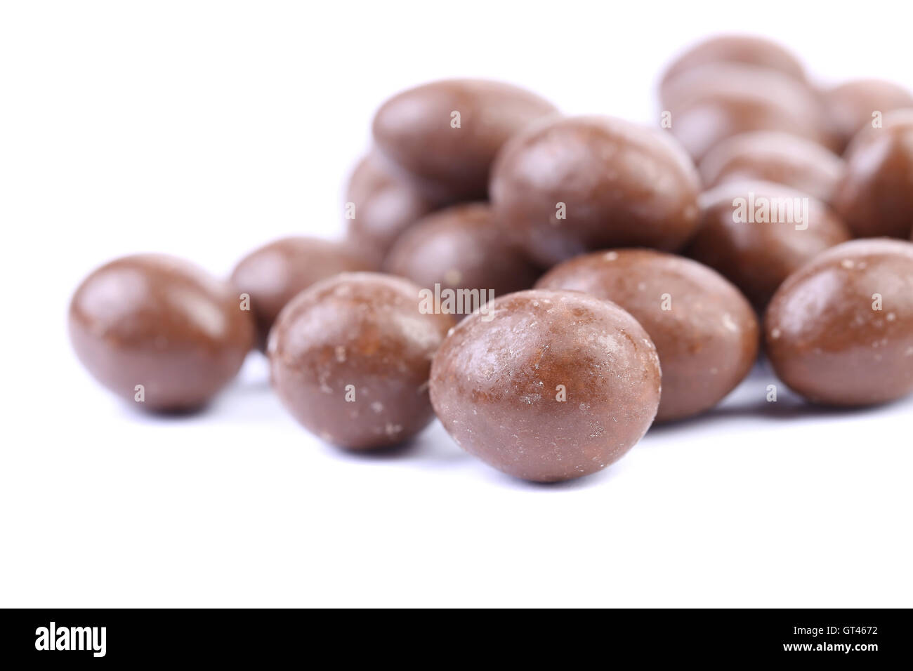 Brown dragee, in chocolate covered Stock Photo - Alamy
