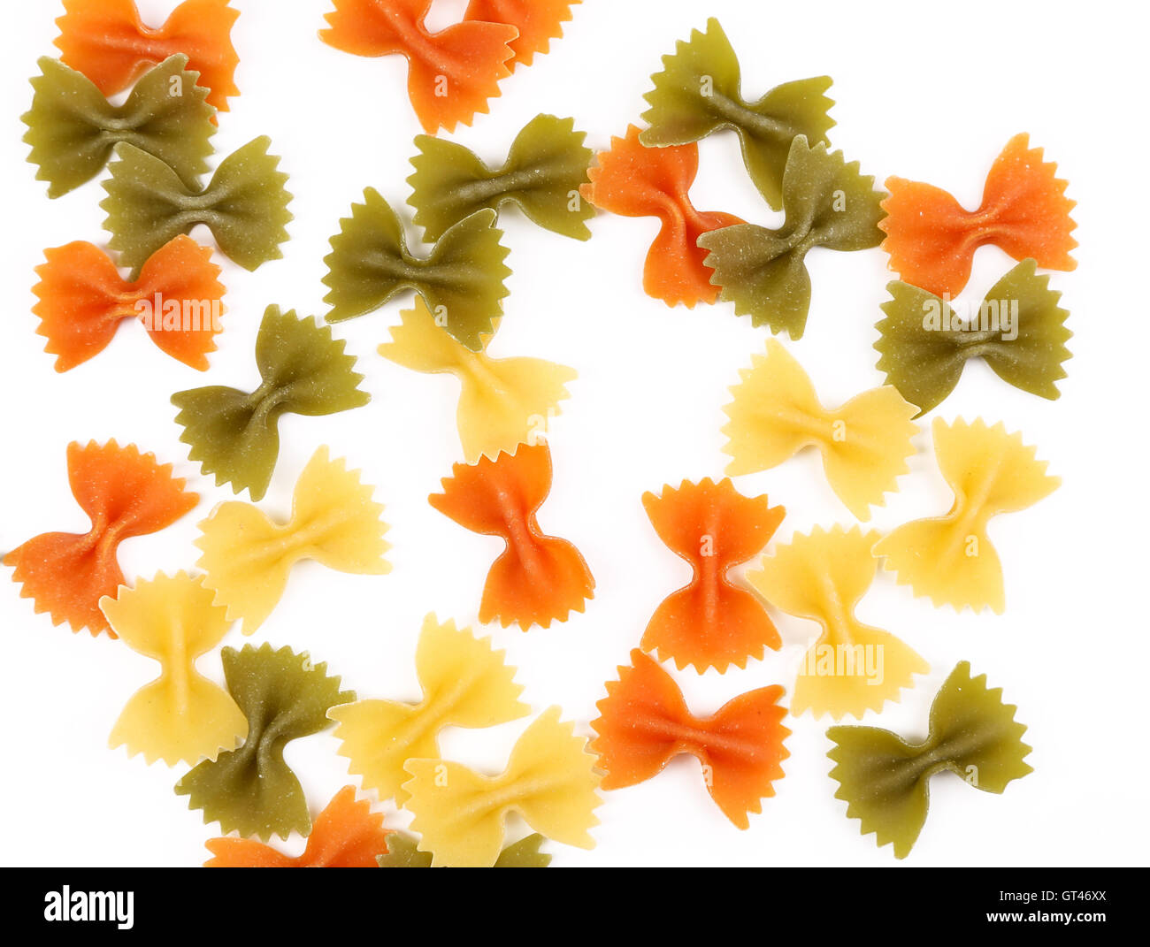 Background of the farfalle pasta three colors Stock Photo - Alamy