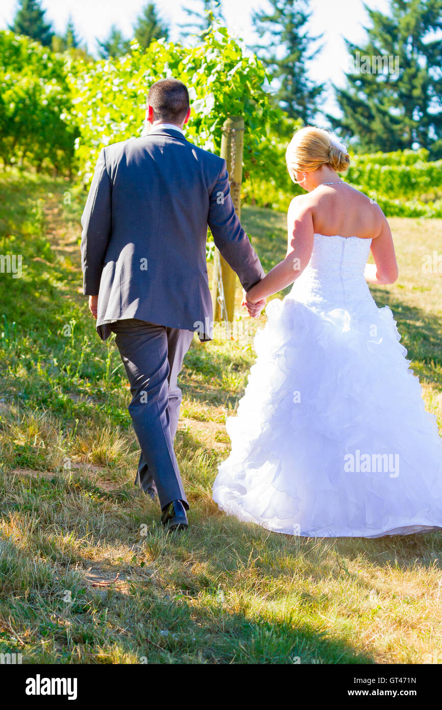 Bride and Groom Walking Away Stock Photo - Alamy